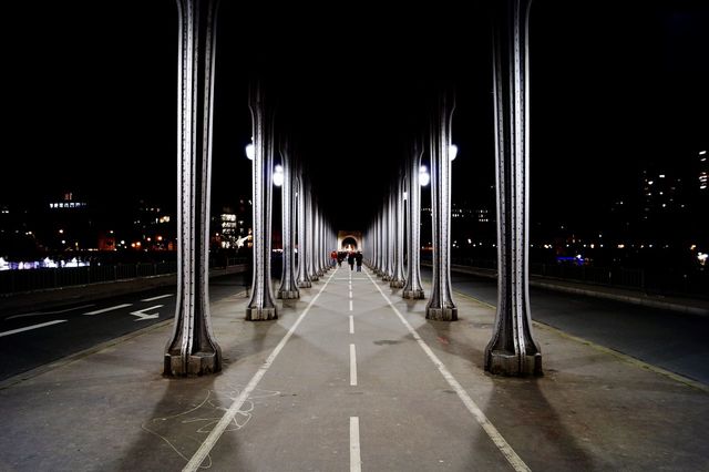View of illuminated road under bridge in | ID: 122172193