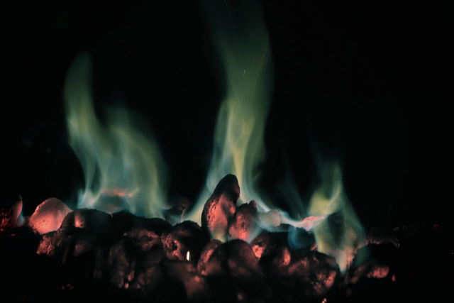 Close-up of fire and coal with blue flames | ID: 144183352