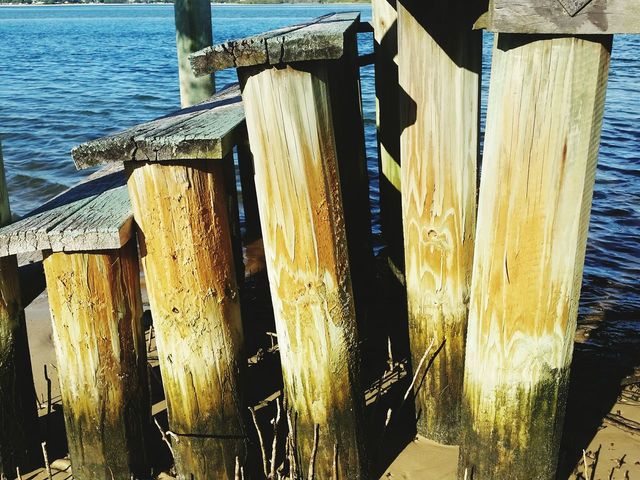 Close-up of wooden posts in sea | ID: 107721496