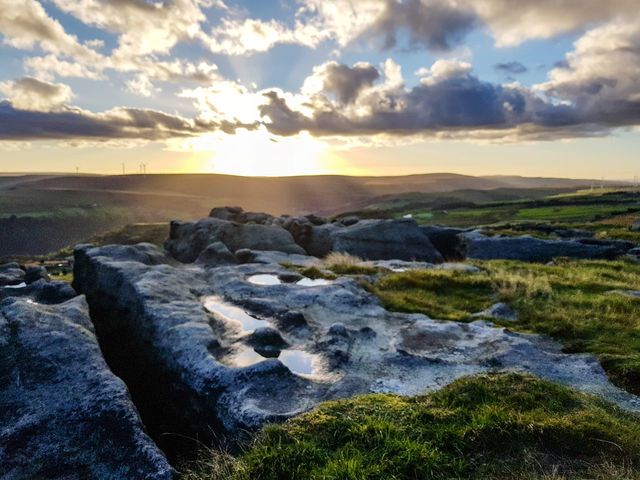 Rocks on land against sky at sunset | ID: 130787291