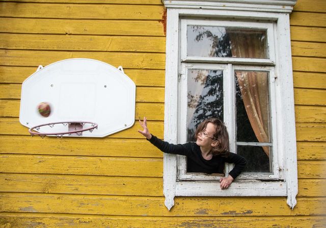 Kid playing with the ball through the window | ID: 152801079