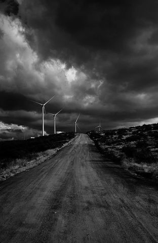 Road by storm clouds over landscape | ID: 102543762