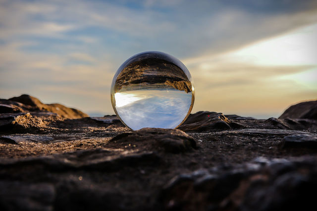 Close-up of crystal ball on rocks | ID: 129589343