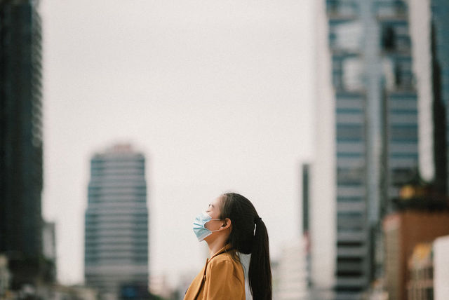 Side view of businesswoman wearing mask | ID: 161727057