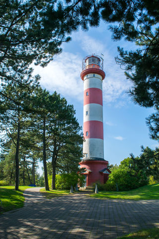 Low angle view of lighthouse against tower | ID: 112900249