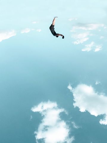 High angle view of man falling over sea | ID: 141684376