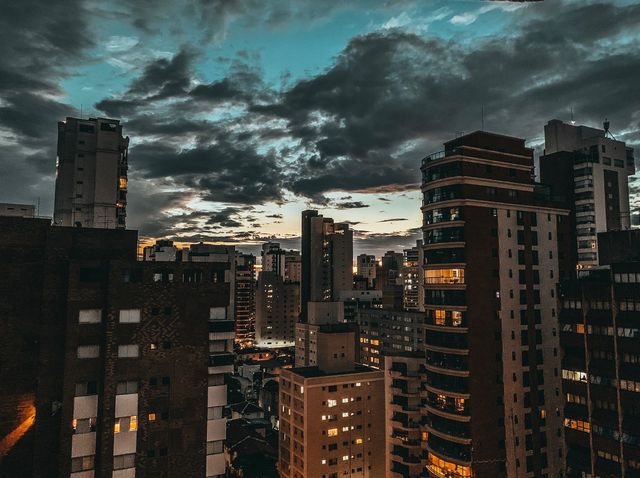 Illuminated buildings in city against sky | ID: 137792814