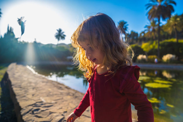 Side view of young woman standing on rock | ID: 199550933