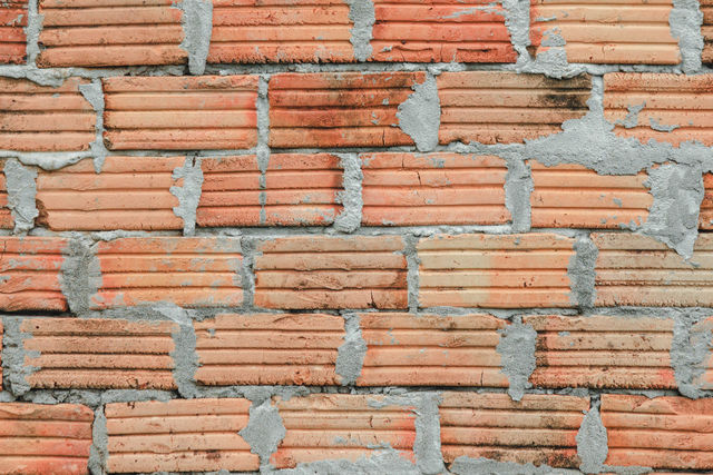 Full frame shot of brick wall with building | ID: 129364811