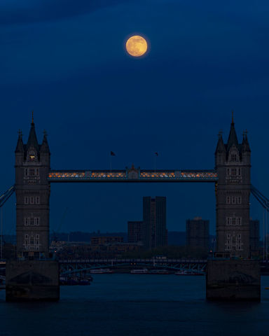 Full moon over bridge against blue sky at | ID: 177671366