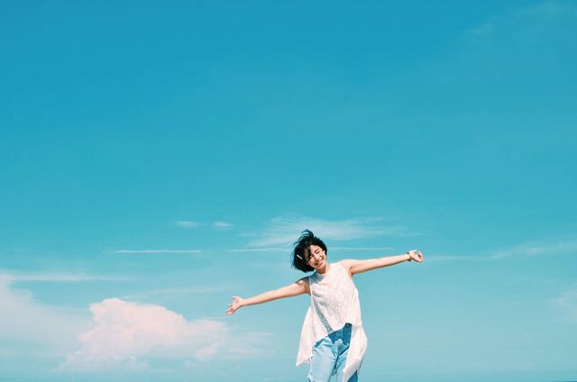 Low angle view of woman standing against | ID: 115307006