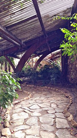 View of stone footpath under roof | ID: 62960929