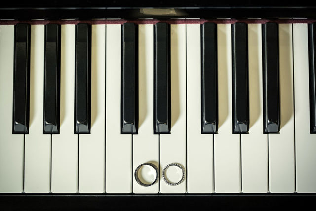 Directly above shot of rings on piano keys | ID: 123805954
