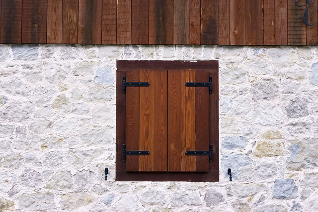 Close-up of closed wooden window amidst | ID: 92381872