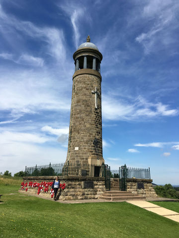 Woman standing by crich memorial against sky | ID: 90226837