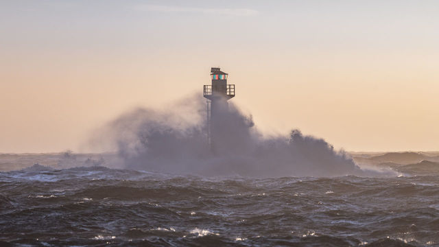 Lighthouse by sea against sky during sunset | ID: 209195834