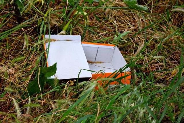 High angle view of broken laptop on field | ID: 122523997
