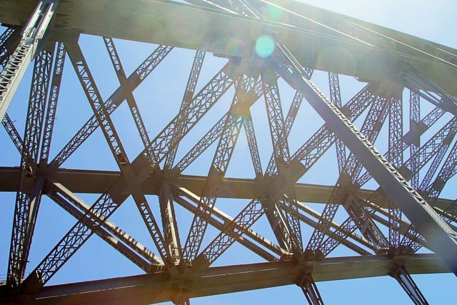 Low angle view of metallic bridge against | ID: 118635927