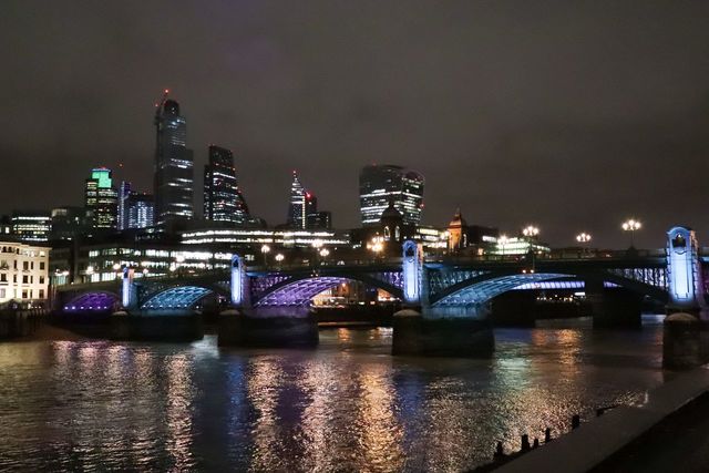 Illuminated modern buildings by river | ID: 146228567