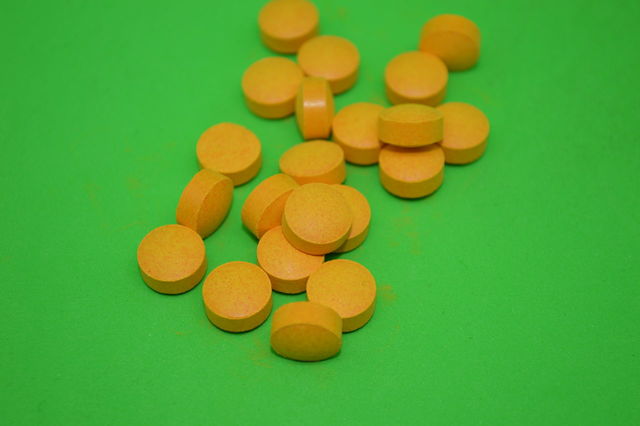 Close-up of pills against green background | ID: 137428276