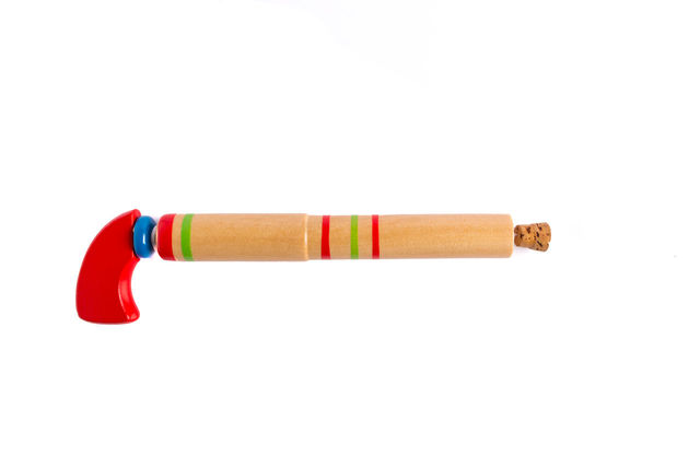 Close-up of wooden pop gun against white | ID: 113812517