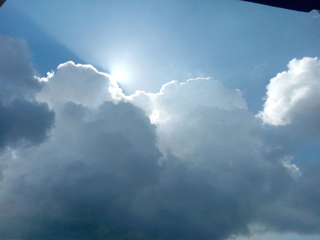 Low angle view of sky and clouds in sunlight | ID: 120276069