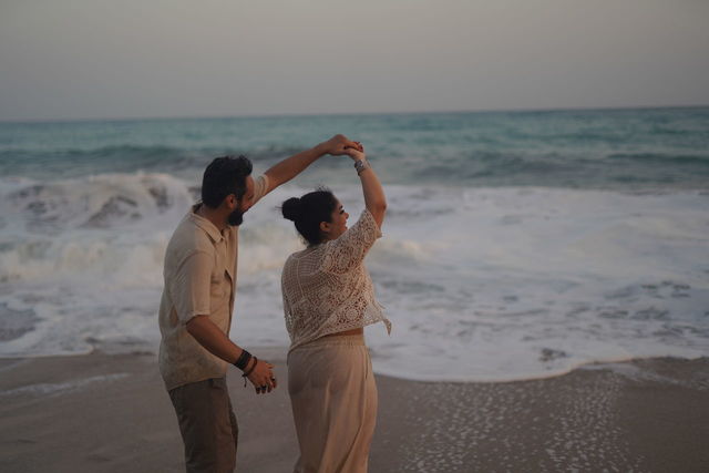 Side view of young woman standing at beach | ID: 216518576
