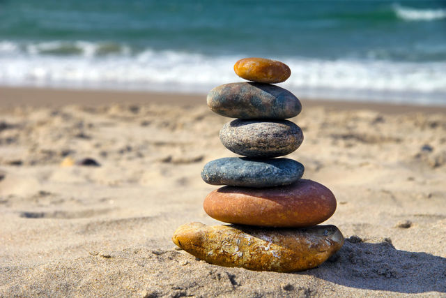 Stack of stones on sand | ID: 121900149