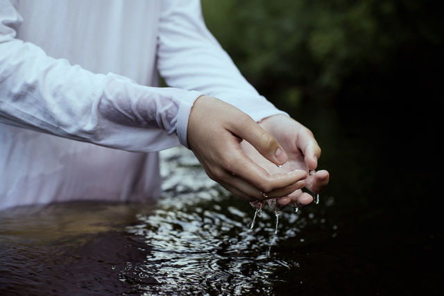 Close-up of hands over water | ID: 108785577
