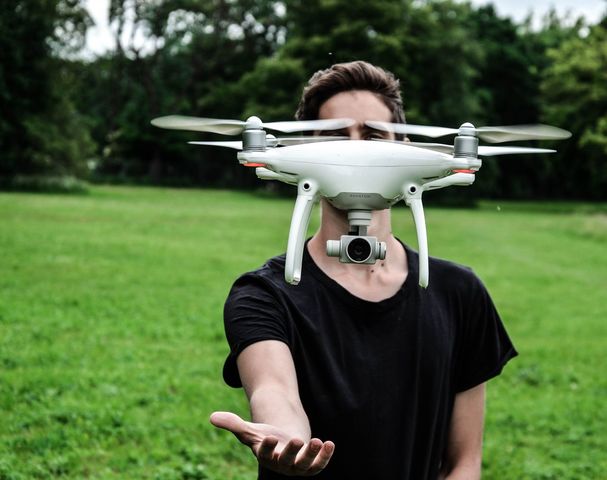 Man with drone on field | ID: 107000416