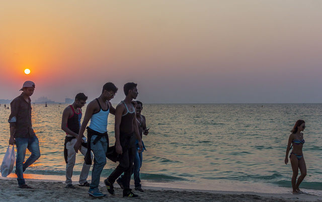 Tourists enjoying on beach | ID: 95350245