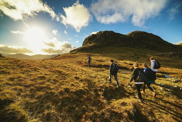 People walking on countryside landscape | ID: 66655994