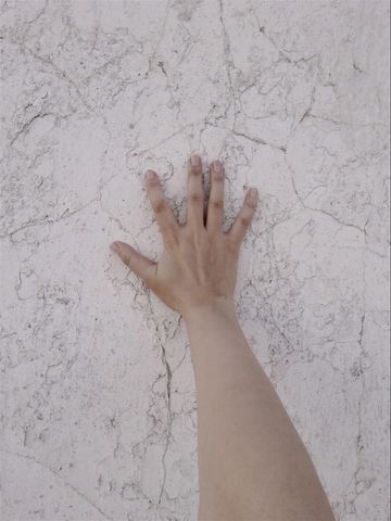 Cropped image of hand against wall | ID: 71367163