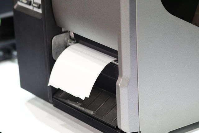 High angle view of paper in printer on table | ID: 140352595