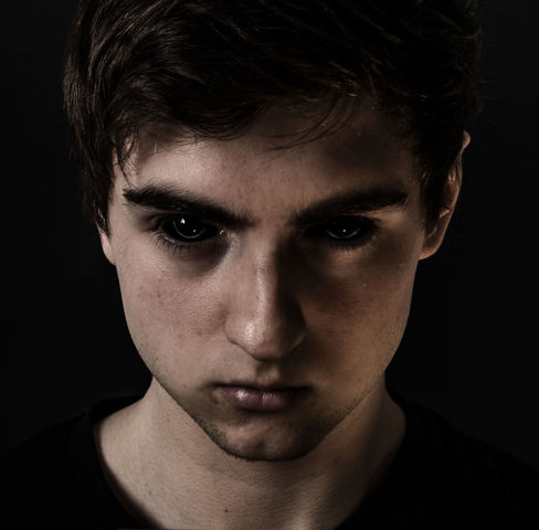 Close-up portrait of serious young man | ID: 137190197