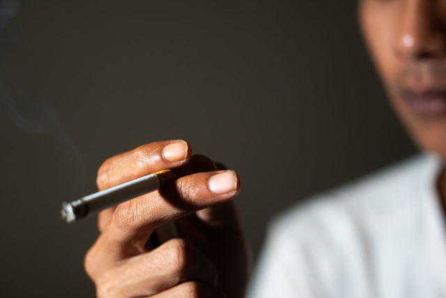 Close-up of man smoking cigarette | ID: 214485317