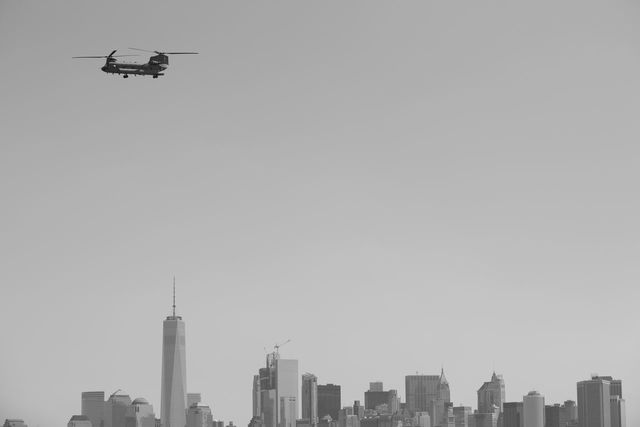Helicopter flying above skyscrapers | ID: 92017919