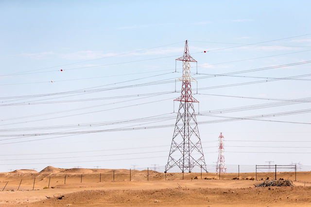 Electricity pylon on field against sky | ID: 136715502