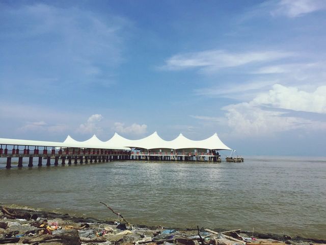 Kuala perlis jetty in sea against sky | ID: 70290447