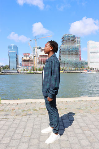 Side view of young man standing on street | ID: 208025202