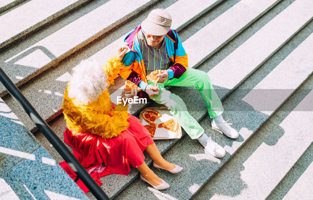 High angle view of woman sitting on steps | ID: 200008106