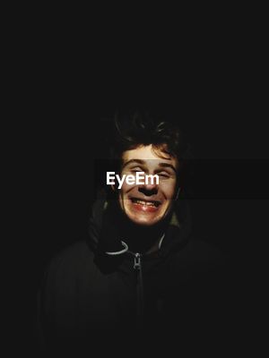 guy smiling in dark