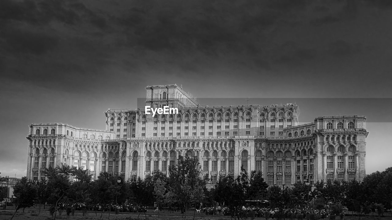 Low angle view of buildings against cloudy | ID: 161695801