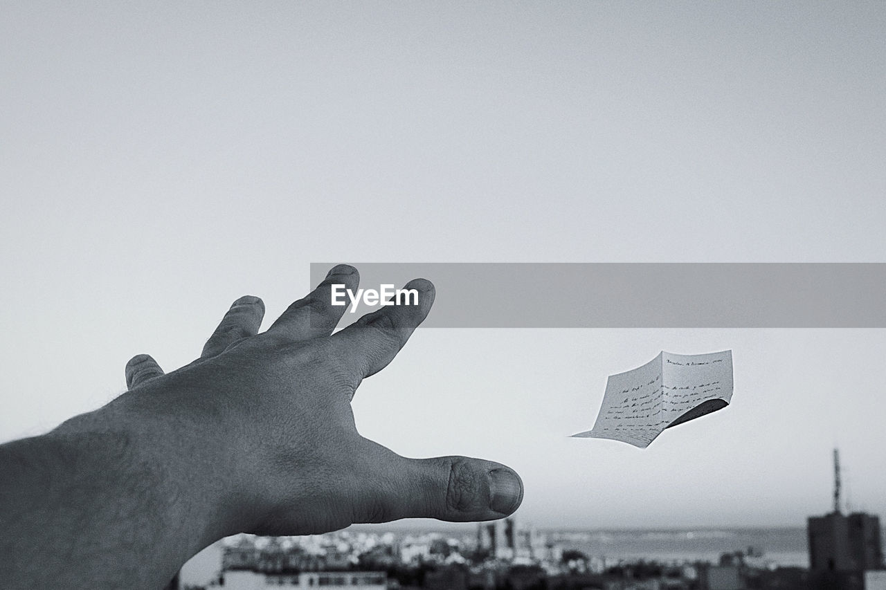Cropped hand of person attempting to catch | ID: 79430383