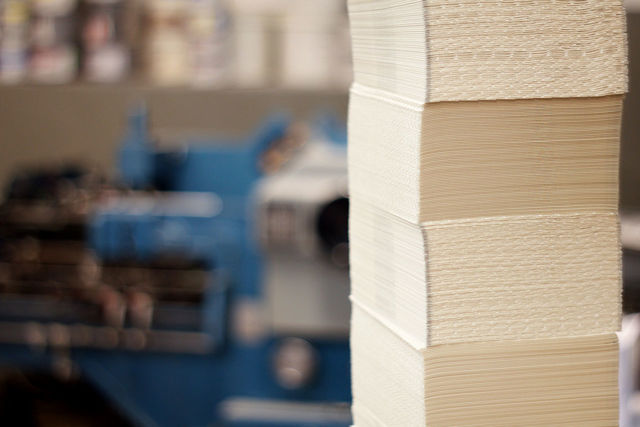 Close-up of stacked papers at printing press | ID: 103244847