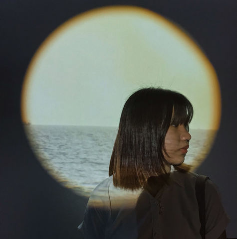 Side view of woman wearing hat standing | ID: 200649565