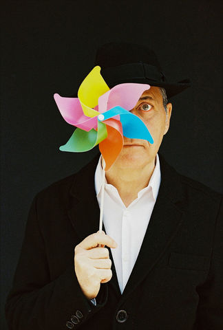 Portrait of a man holding a pinwheel | ID: 193679327