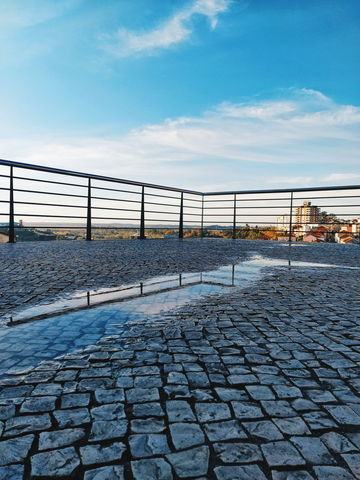 Cobblestone street by swimming pool against | ID: 151094878