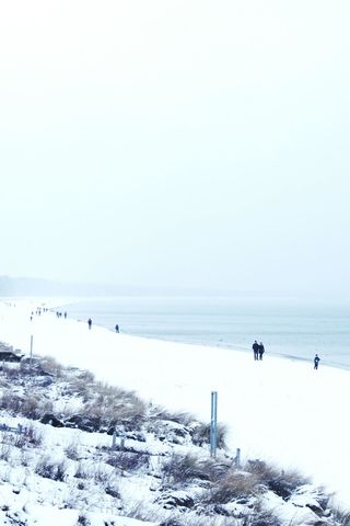 Scenic view of snow covered beach against sky | ID: 79408496