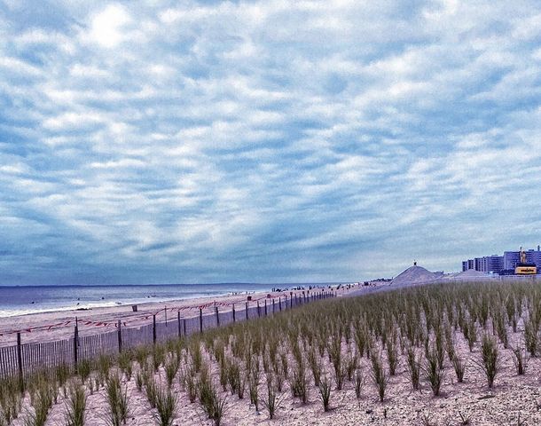 Scenic view of sea against cloudy sky | ID: 73101110